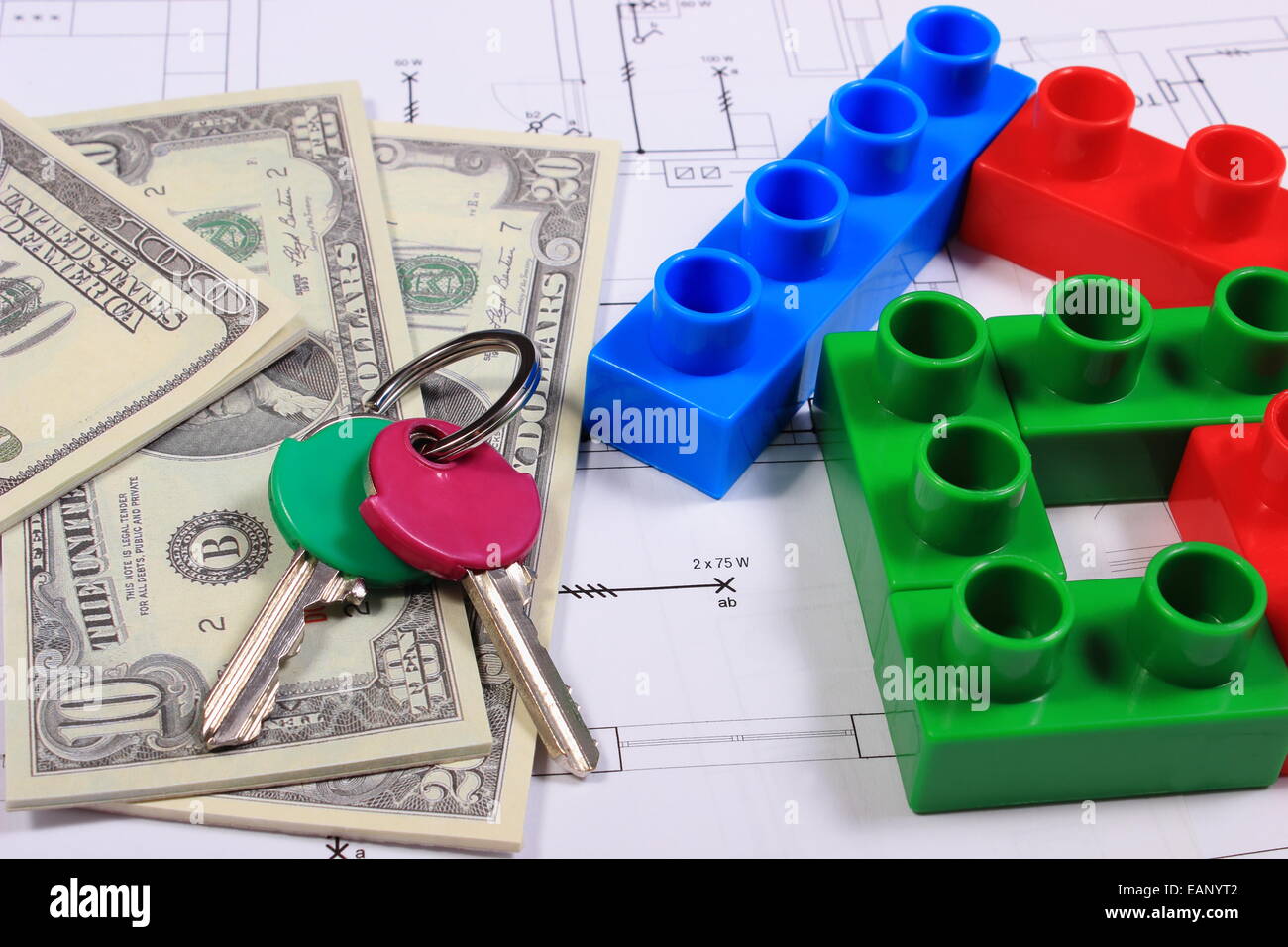 House shape of colorful building blocks, home keys and banknotes on ...