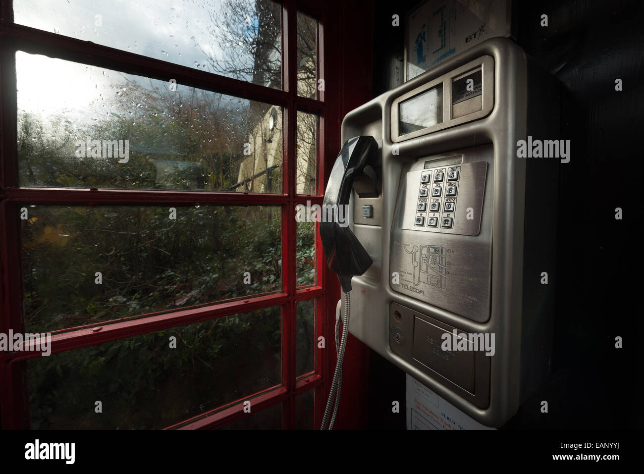 traditional old fashioned unused red telephone box illustrating ...