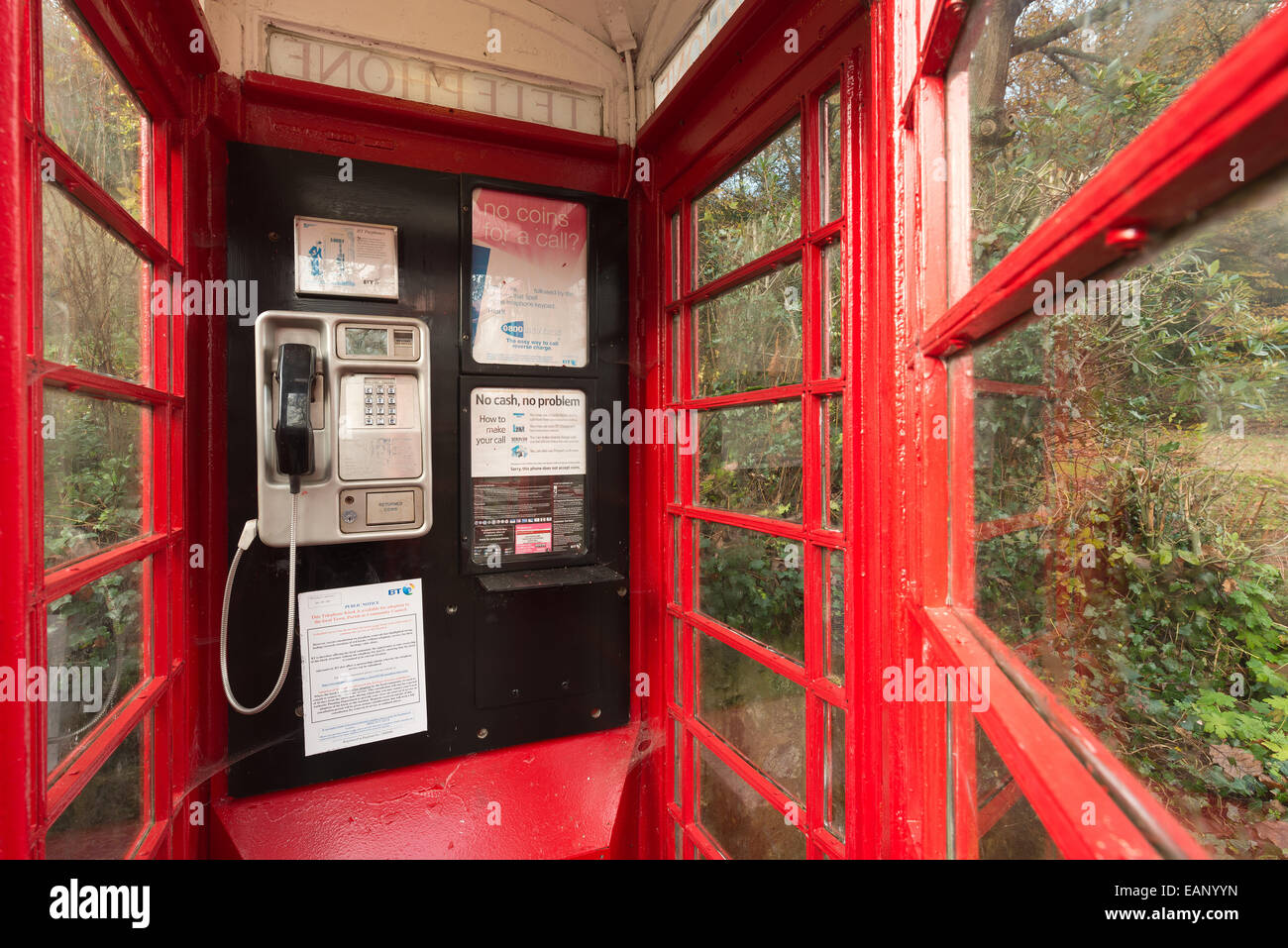 traditional old fashioned unused red telephone box illustrating ...