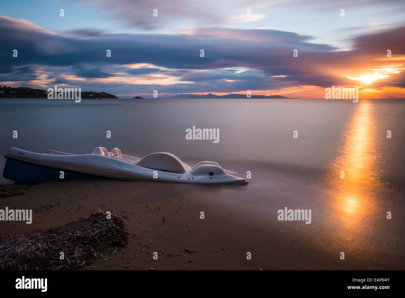 Sunk sea vessel in a summer sandy beach during a wonderful sunset Stock ...