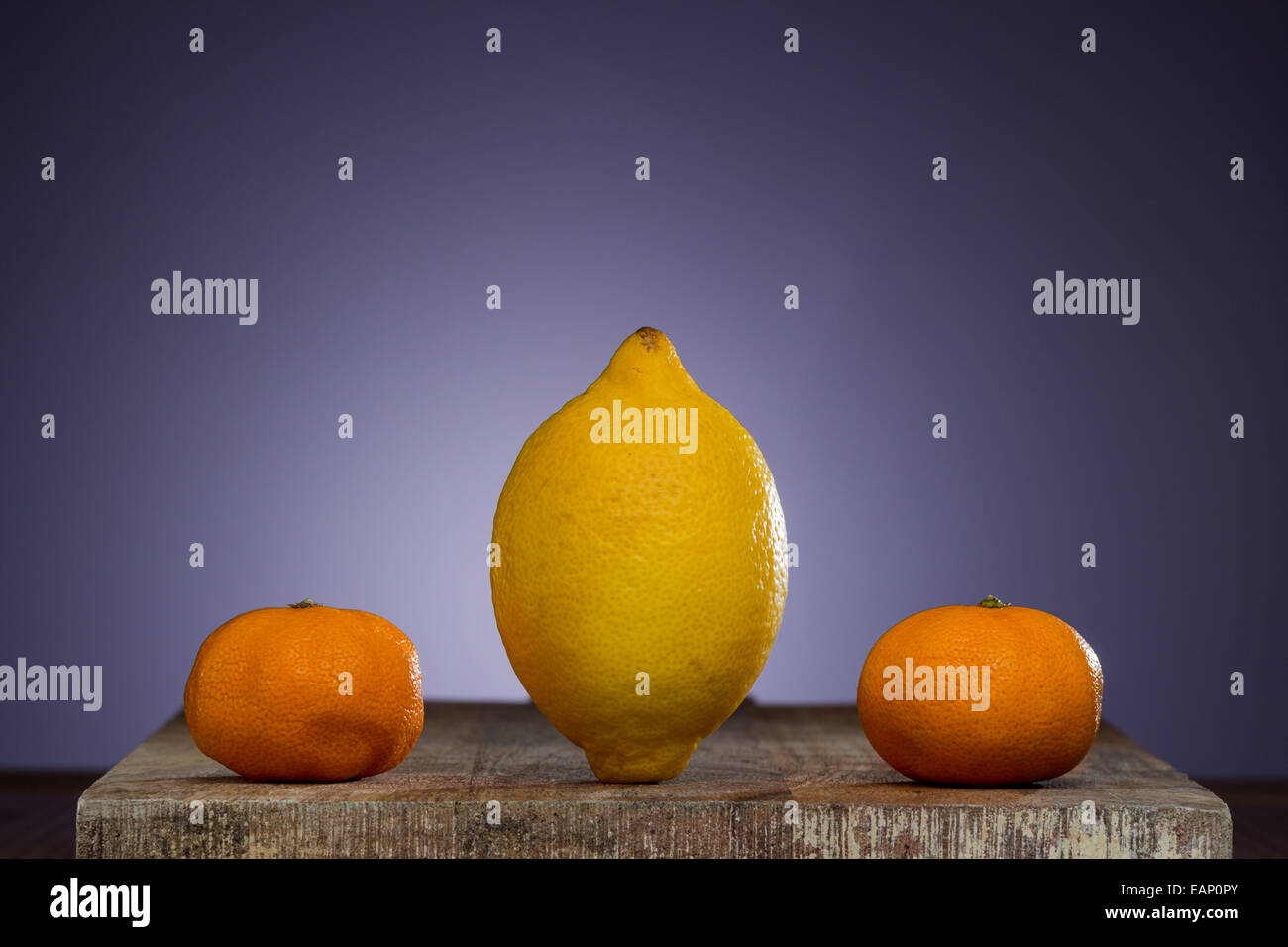 Still life on wooden board with halo effect lighting Stock Photo - Alamy