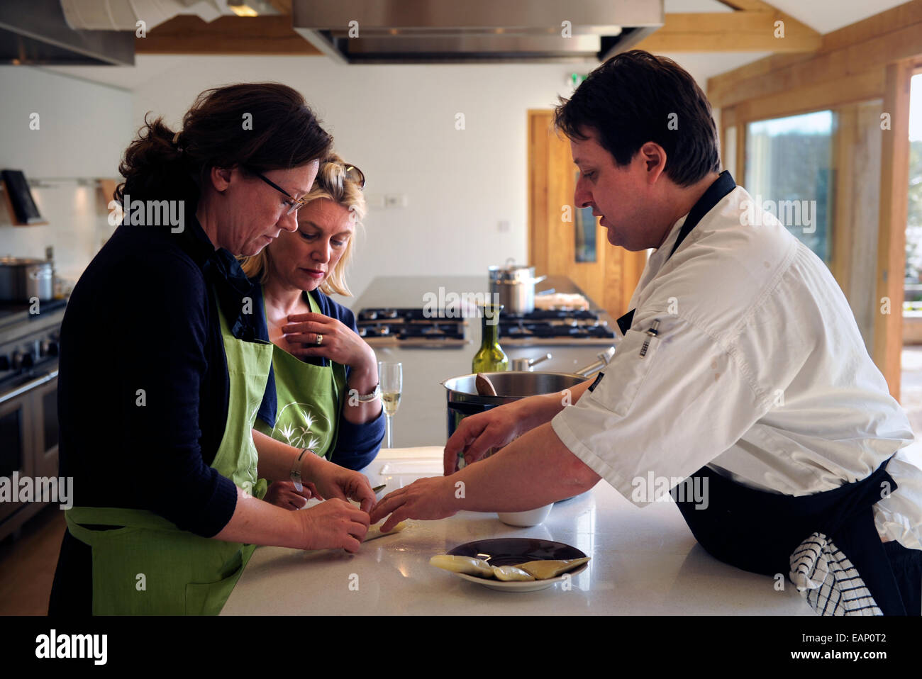 Learning how to fold samosas with chef James Graham during a chicken ...
