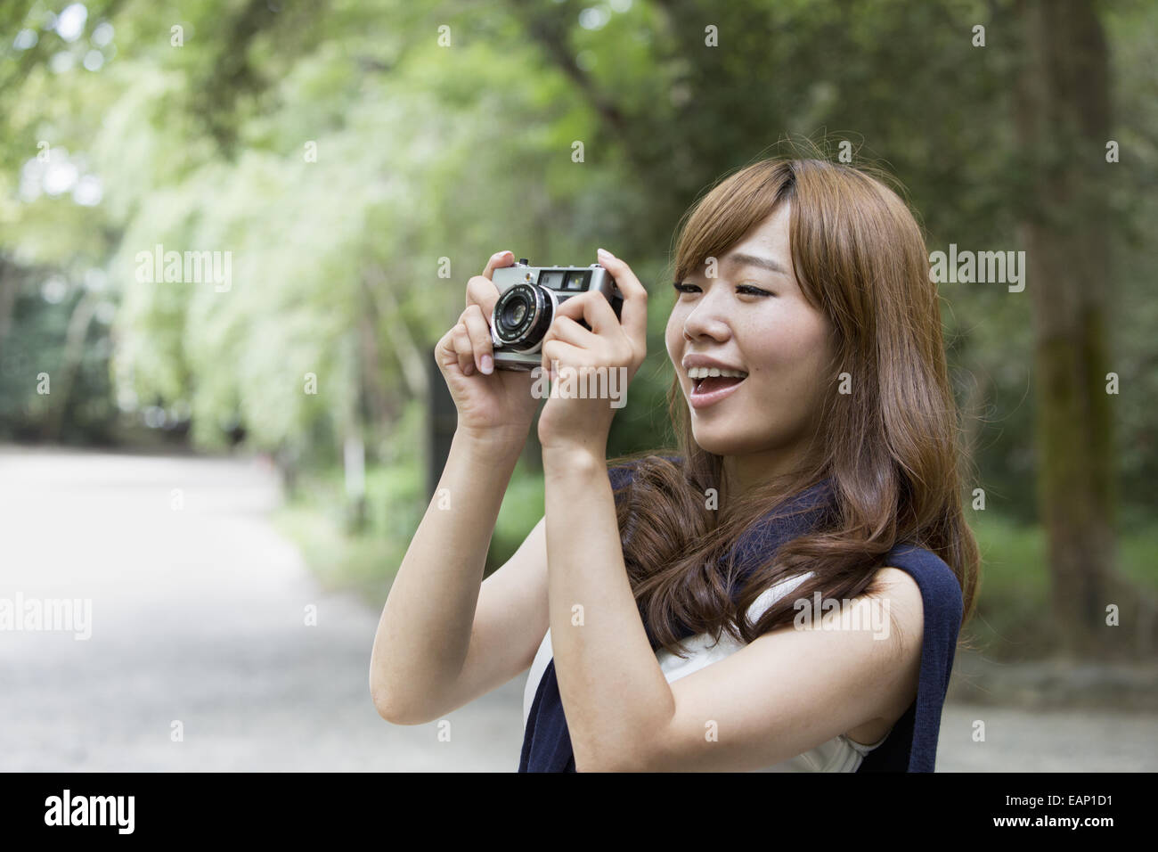 Person holding camera hi-res stock photography and images - Alamy
