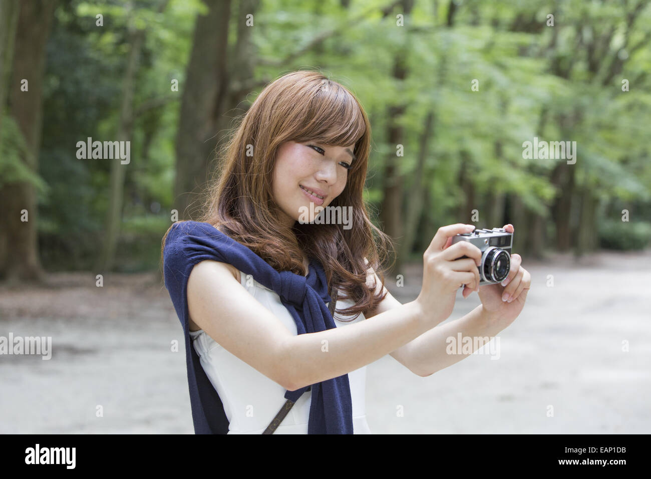 Young asian woman taking pictures hi-res stock photography and images ...