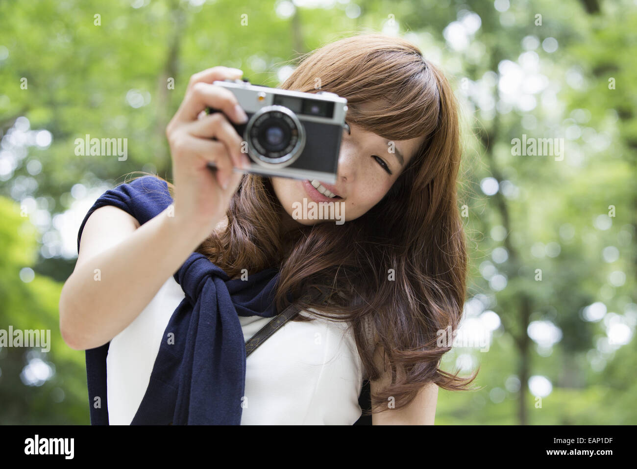 Person holding camera hi-res stock photography and images - Alamy
