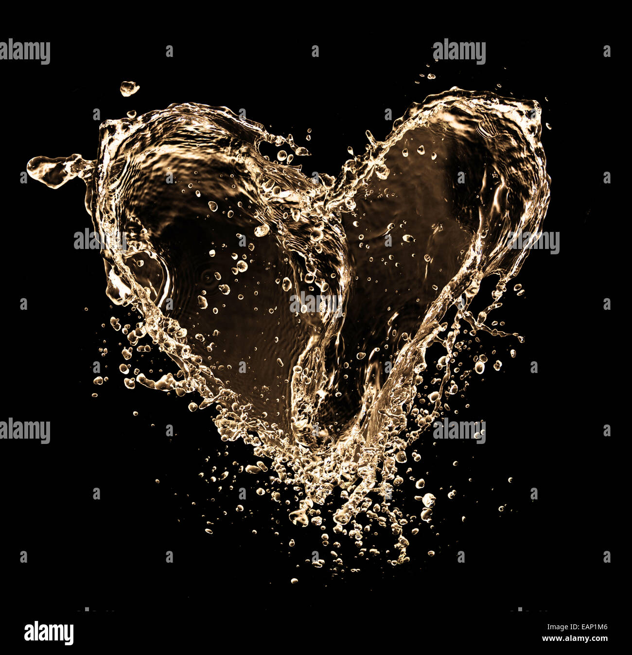 Heart symbol made of liquid splashes, isolated on balck background ...
