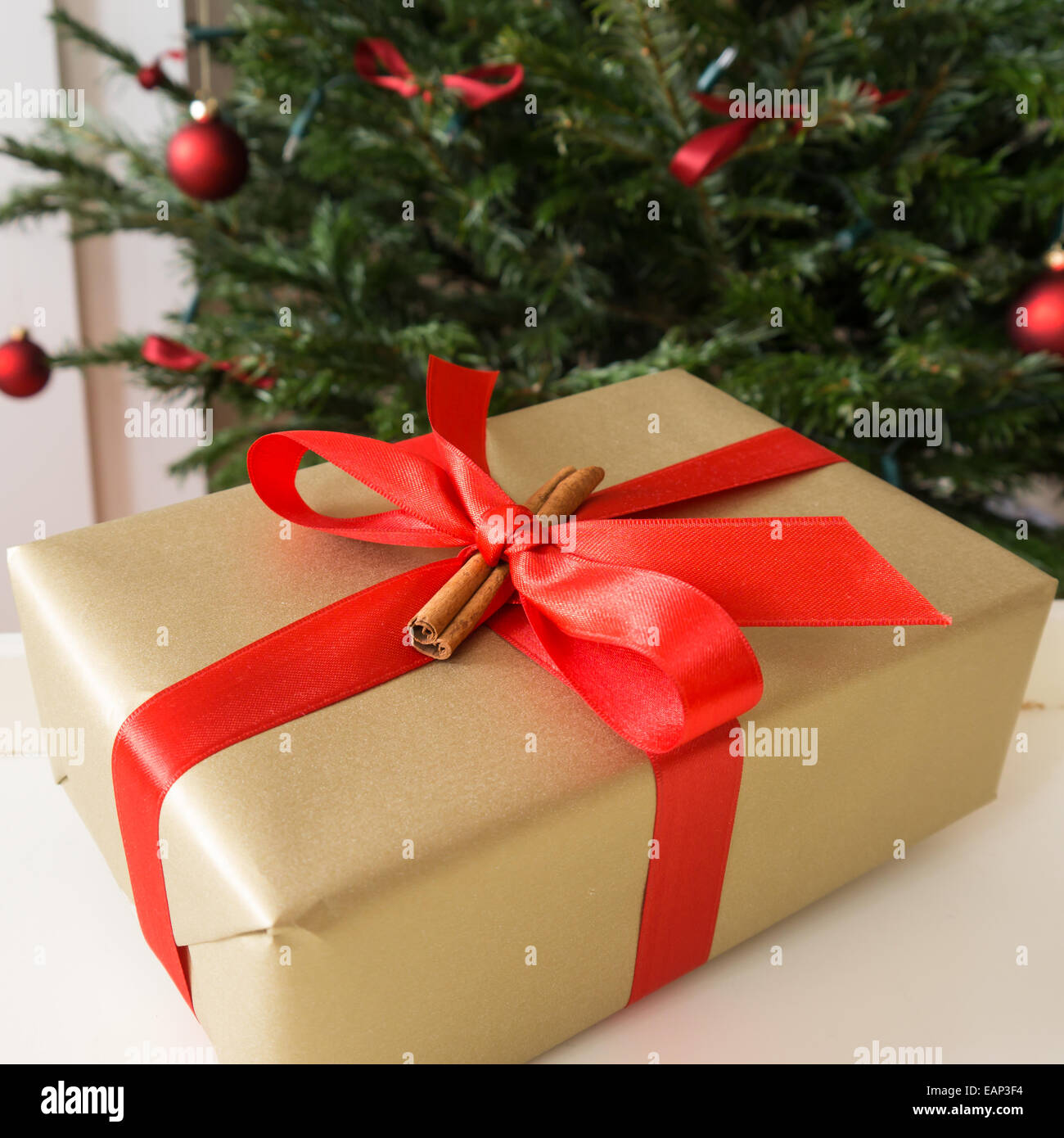 present and christmas tree with daylight Stock Photo - Alamy