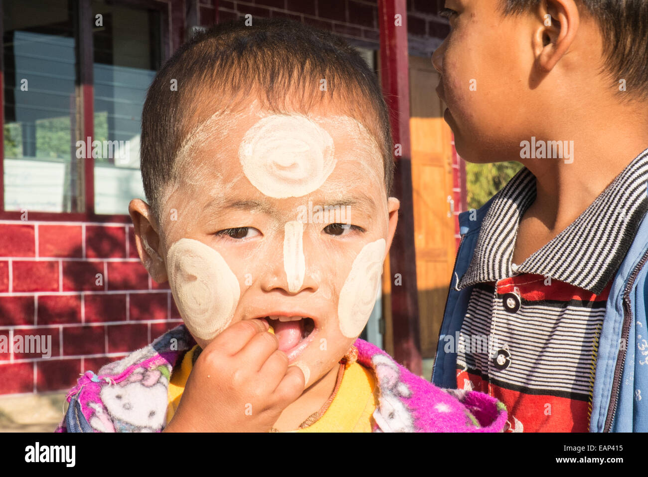 Children with face paint, traditional thanaka cream paste at local ...
