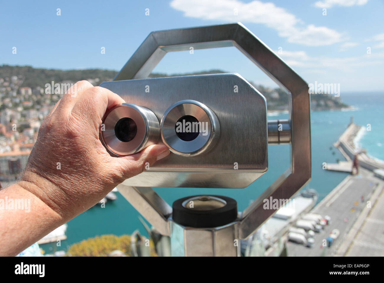 hand holding a tourist telescope Stock Photo - Alamy