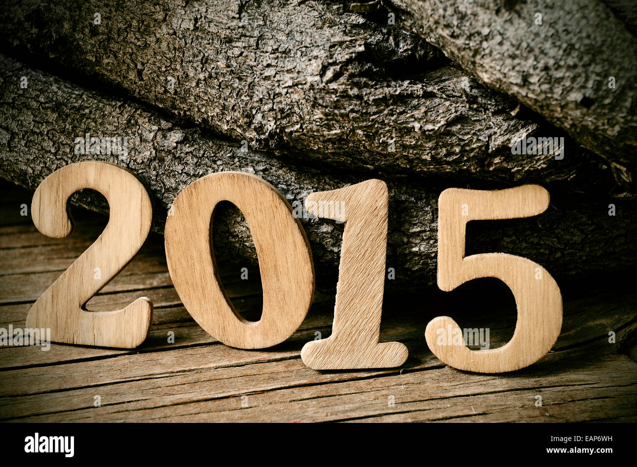 wooden numbers forming the number 2015, as the new year, with a pile of ...