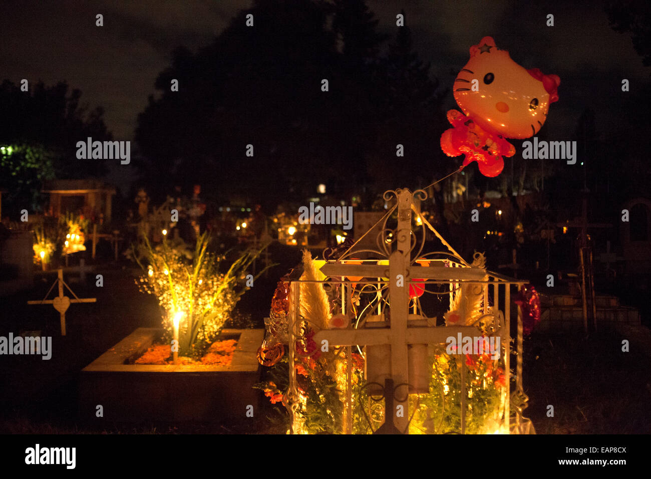 A Hello Kitty balloon decorates a child´s tomb at the cemetery of San ...
