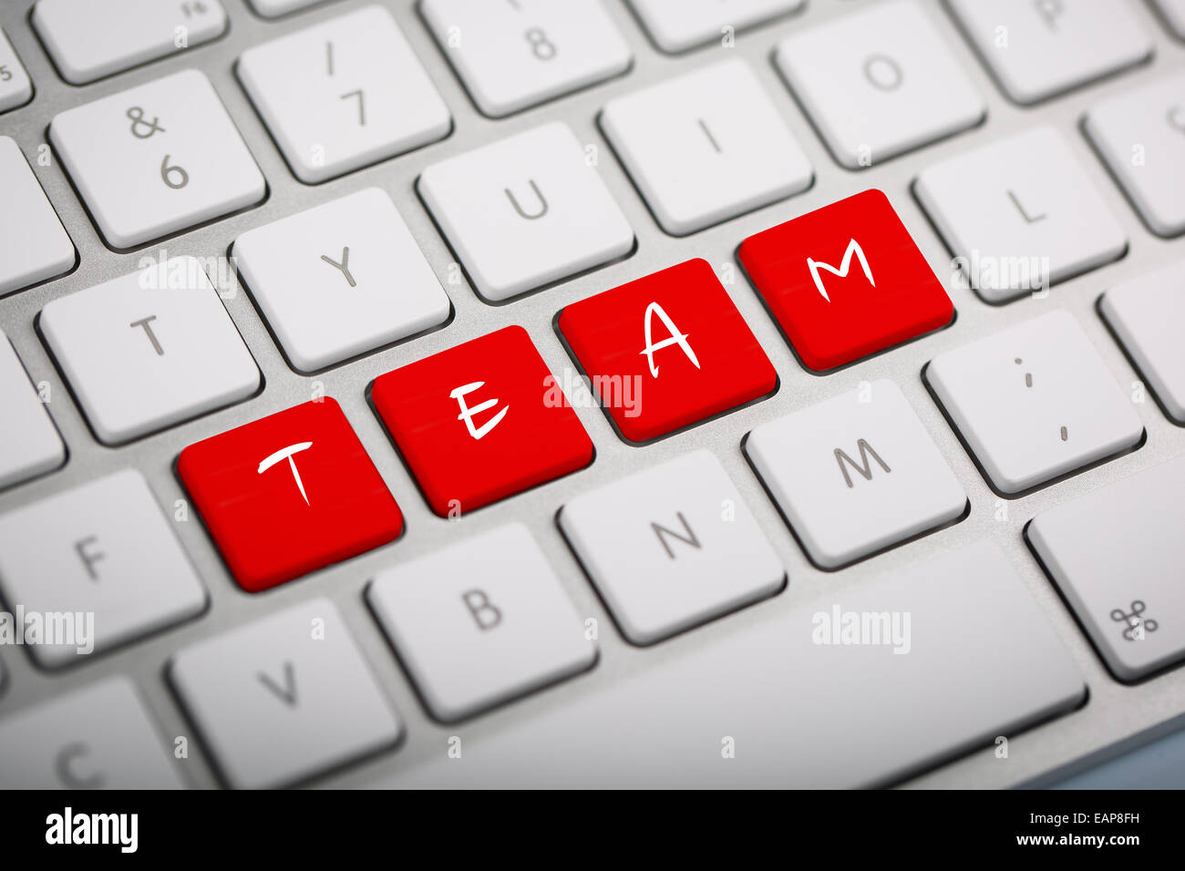 The word "TEAM" written on metallic keyboard Stock Photo - Alamy