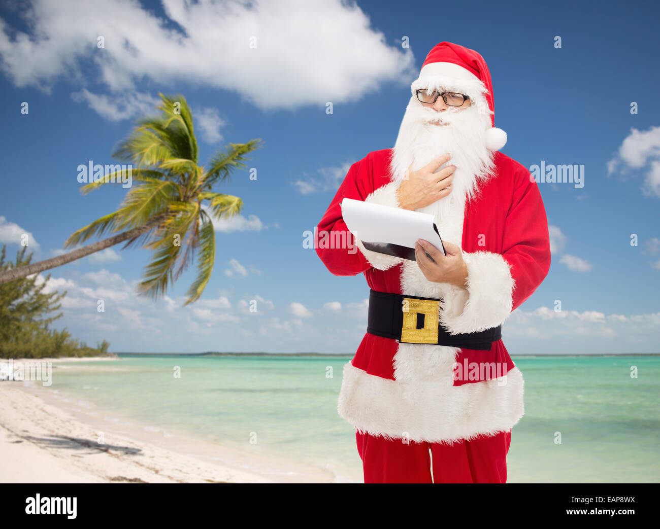 man in costume of santa claus with notepad Stock Photo - Alamy