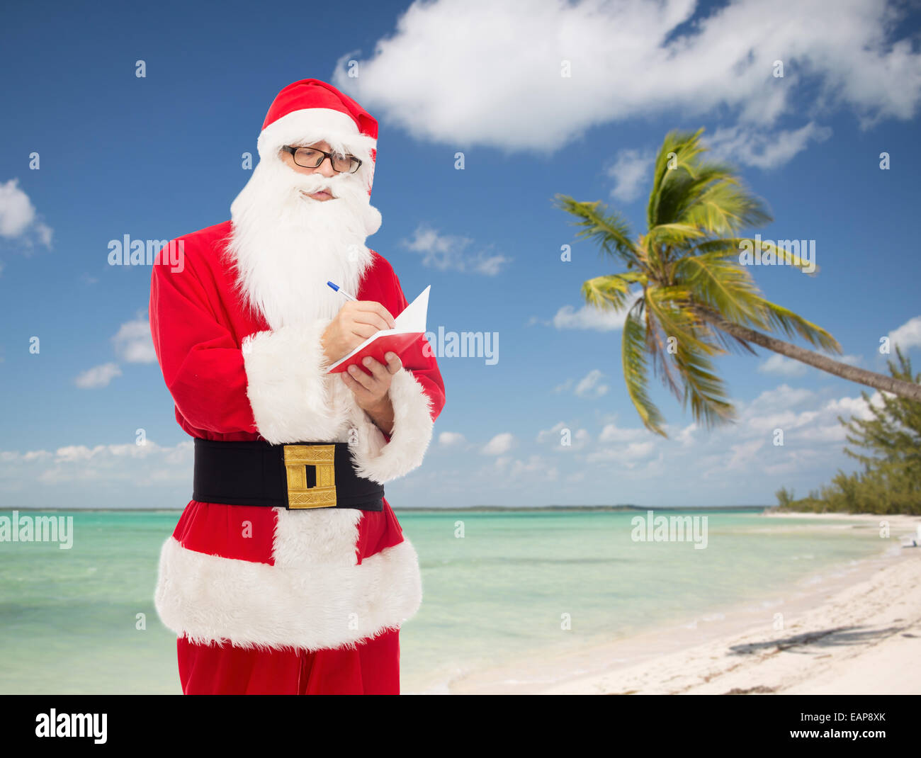 man in costume of santa claus with notepad Stock Photo - Alamy