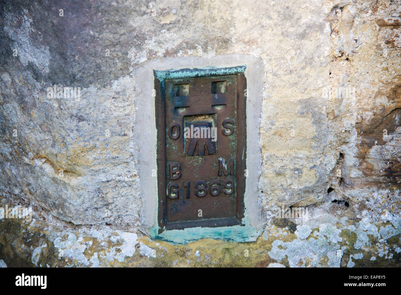 An Ordnance Survey Benchmark G1869 in a wall at Rye, East Sussex Stock ...