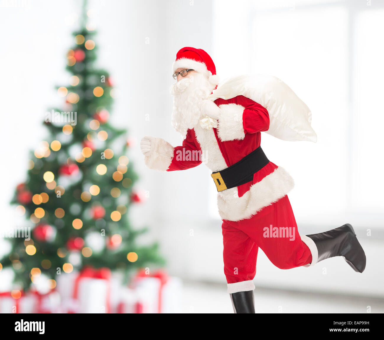 man in costume of santa claus with bag Stock Photo - Alamy