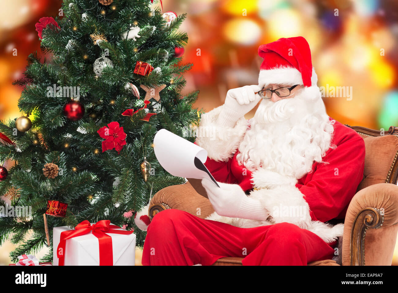 man in costume of santa claus with notepad Stock Photo - Alamy