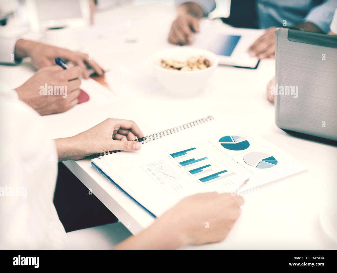 Business team discussing analyzing charts hi-res stock photography and ...