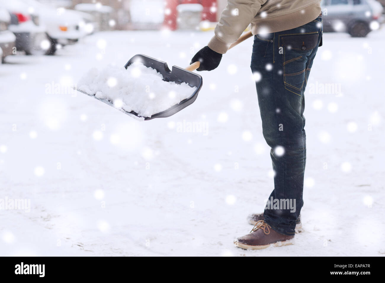 Man shoveling snow near hi-res stock photography and images - Alamy