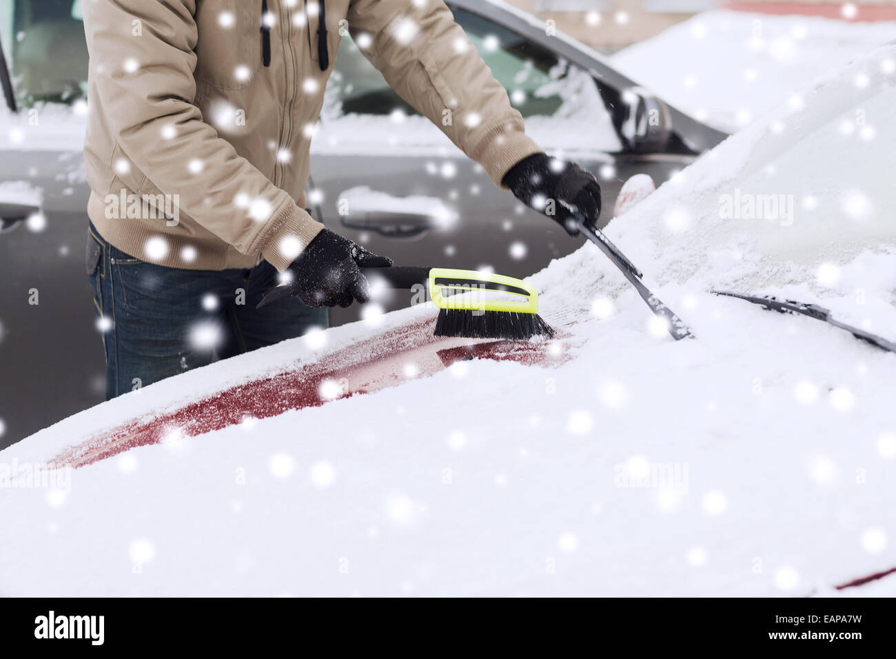 closeup of man cleaning snow from car Stock Photo - Alamy