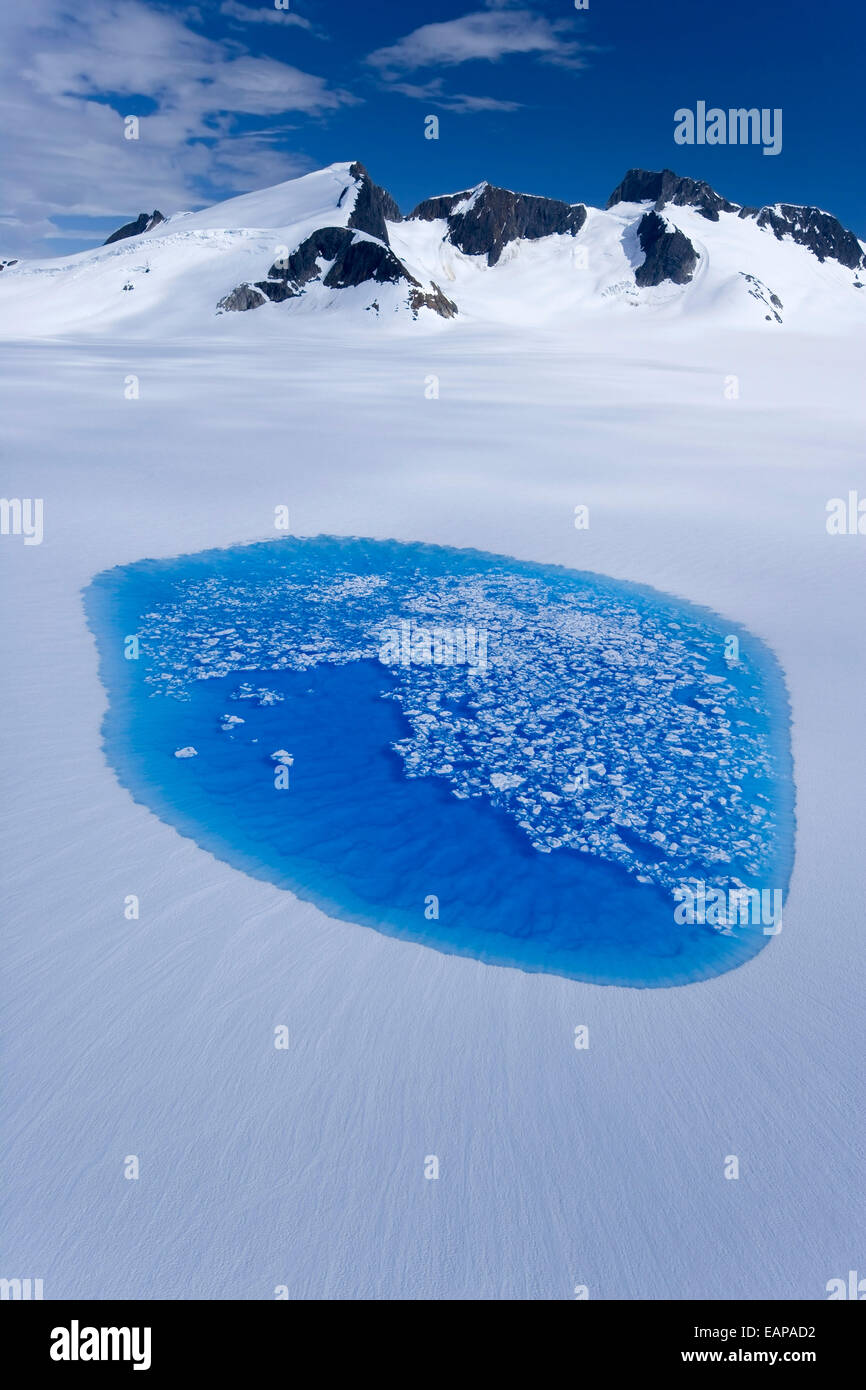 Breaking Surface Ice Reveals The Brilliant Blue Waters Of A Melt Pond ...