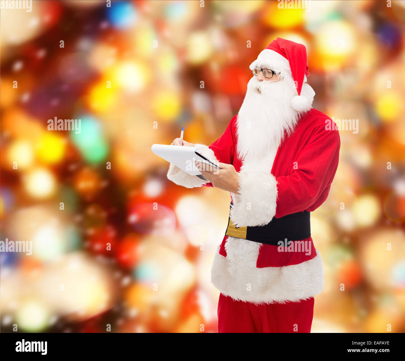 man in costume of santa claus with notepad Stock Photo - Alamy