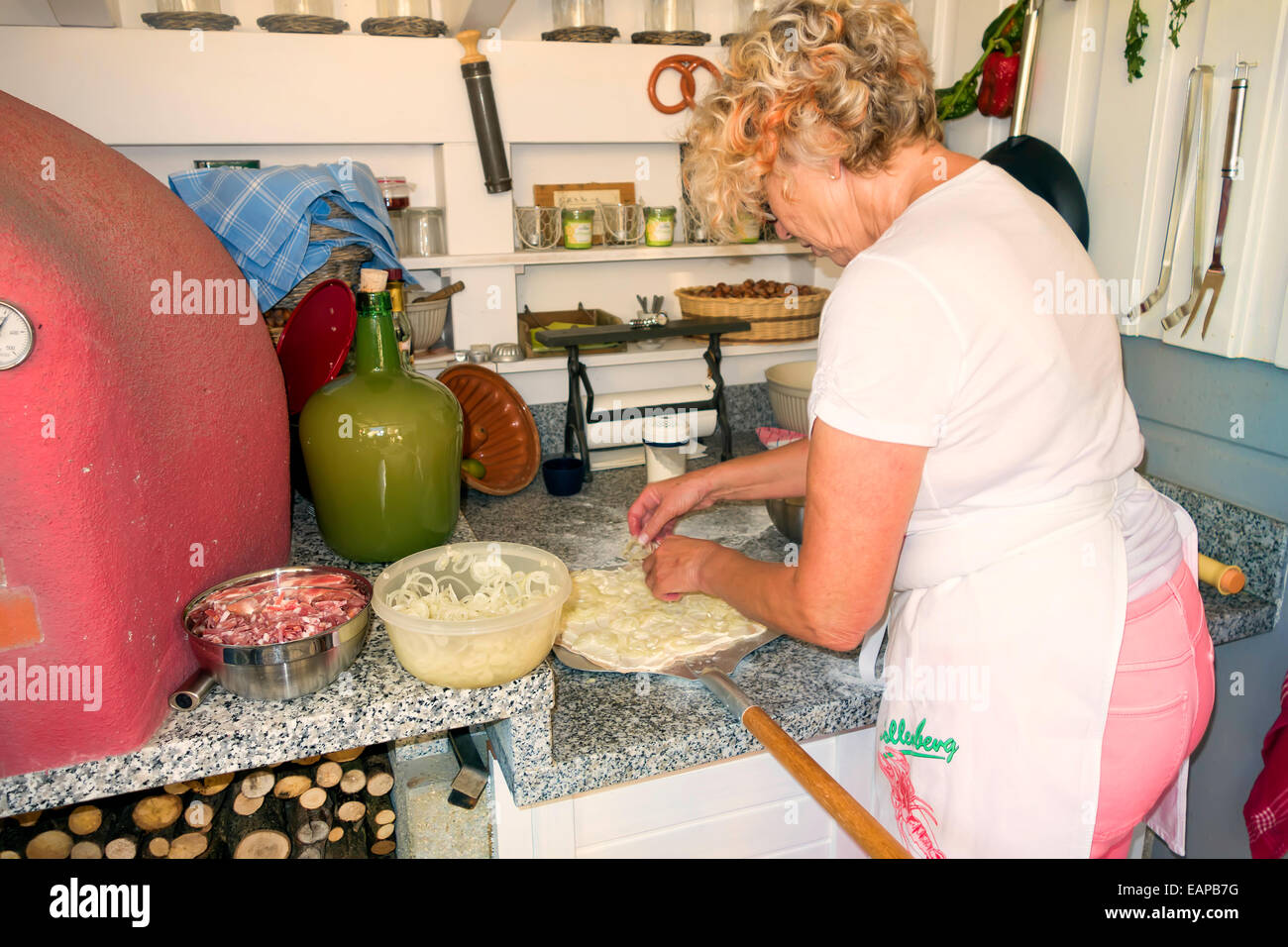 Outdoor baking of a South German tradition;Flammkuchen in a Wood ...