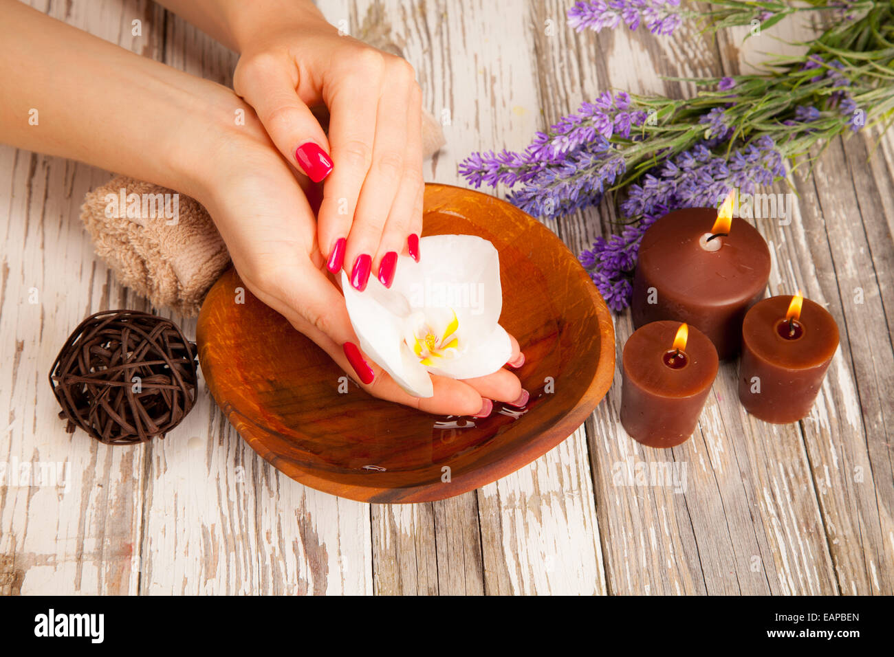 Soft woman hands with colored nails Stock Photo - Alamy