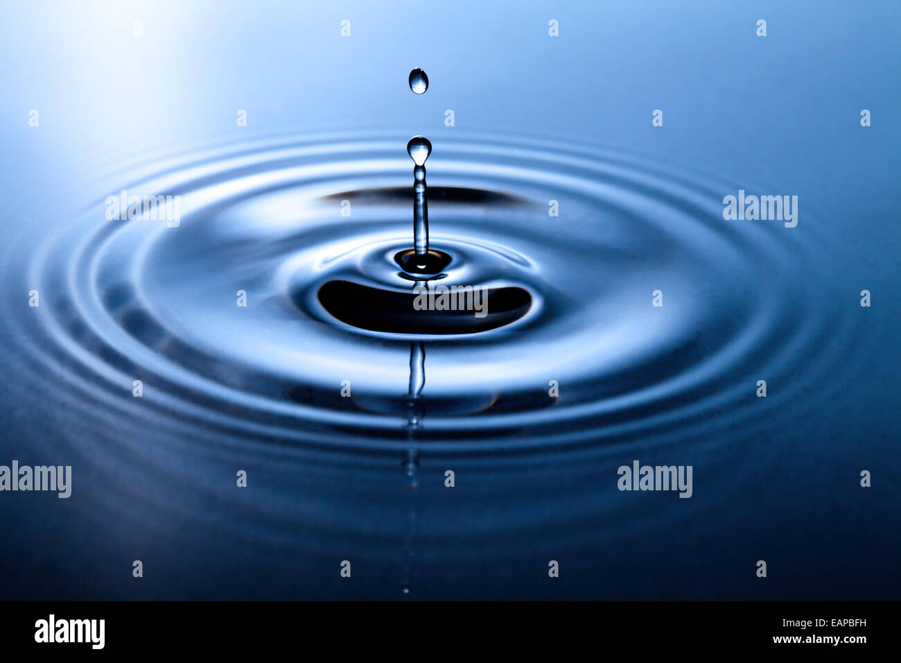 Macro shot of water drop falling Stock Photo - Alamy