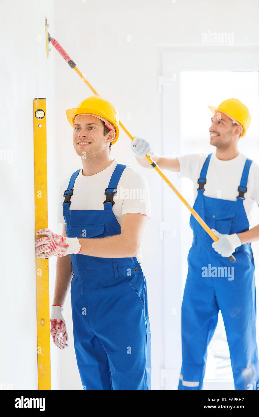 group of builders with tools indoors Stock Photo - Alamy
