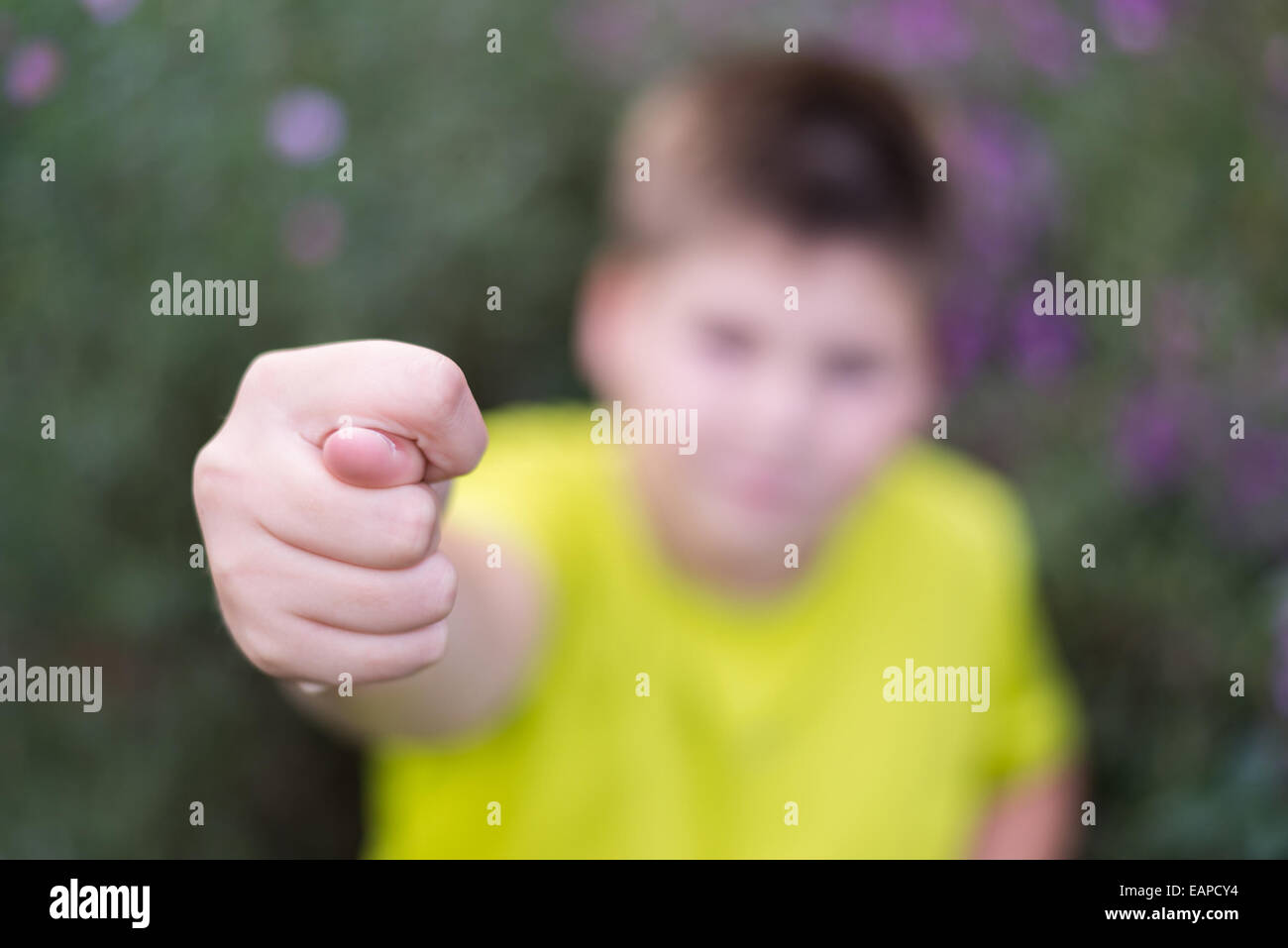Teen boy shows the hand gesture Stock Photo - Alamy