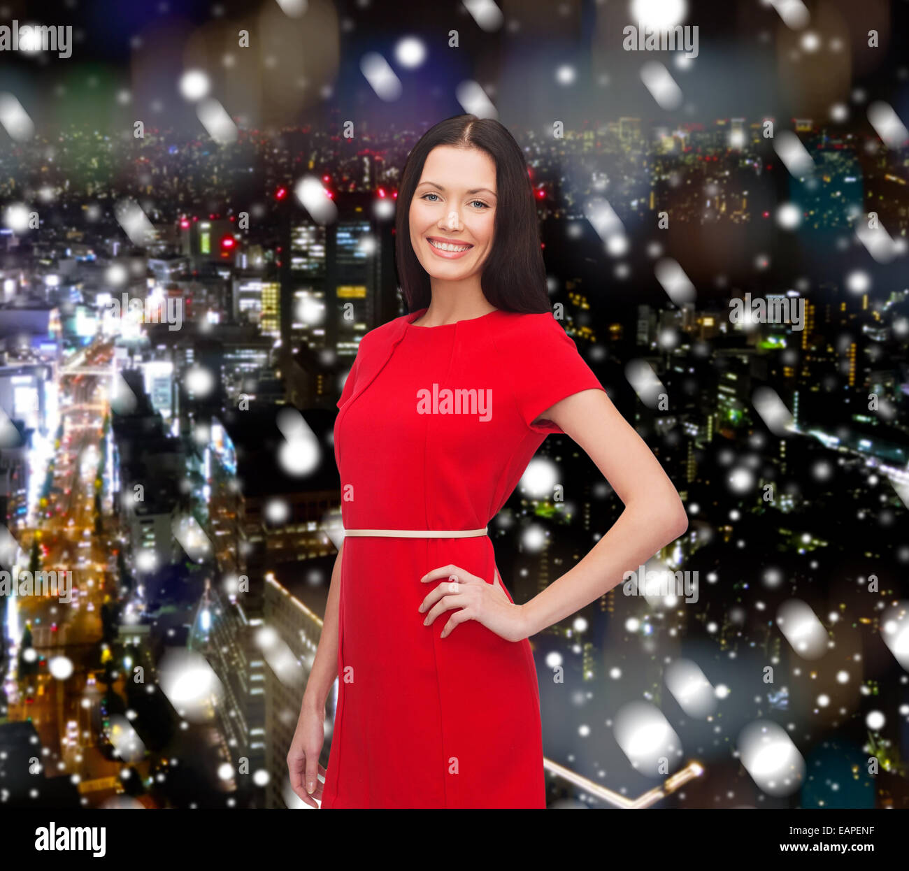 smiling woman in red dress Stock Photo - Alamy