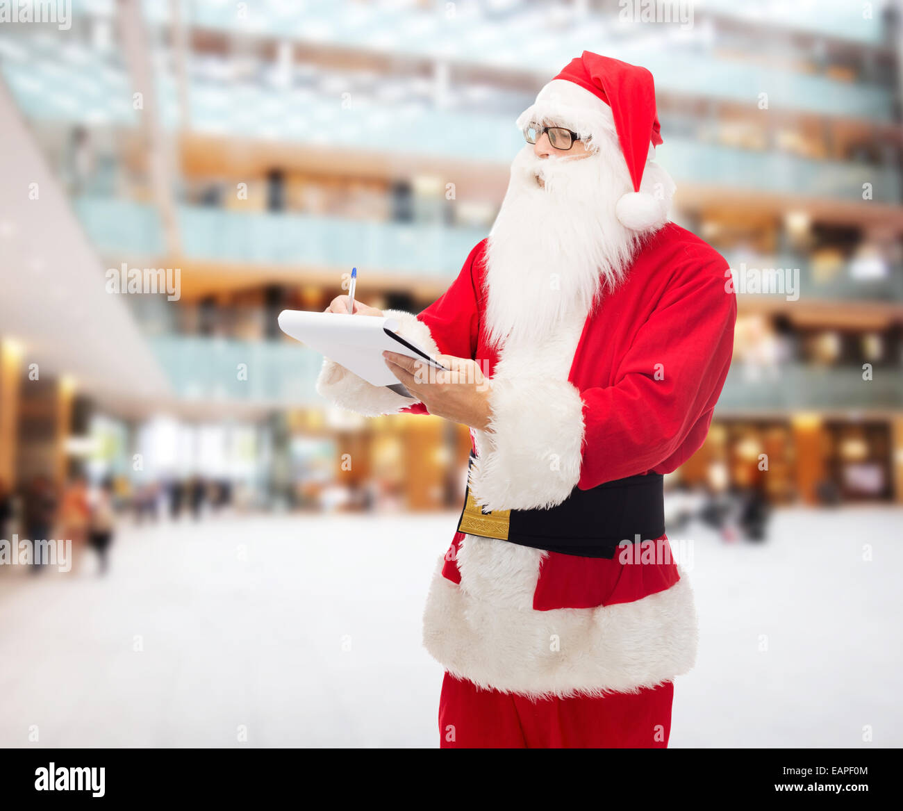 man in costume of santa claus with notepad Stock Photo - Alamy