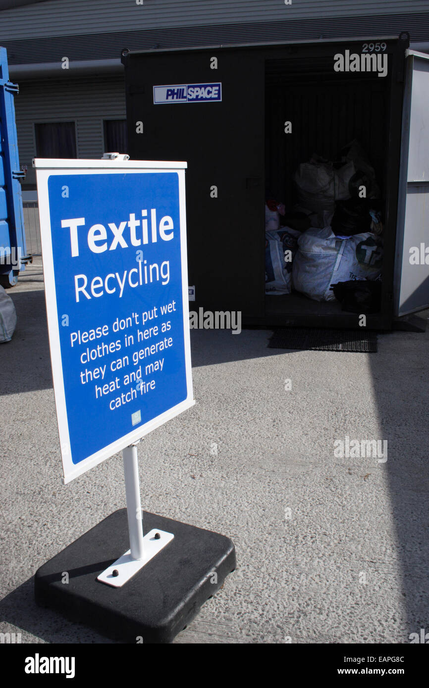amenity tip & recycling, textile recycling sign & skip Stock Photo - Alamy