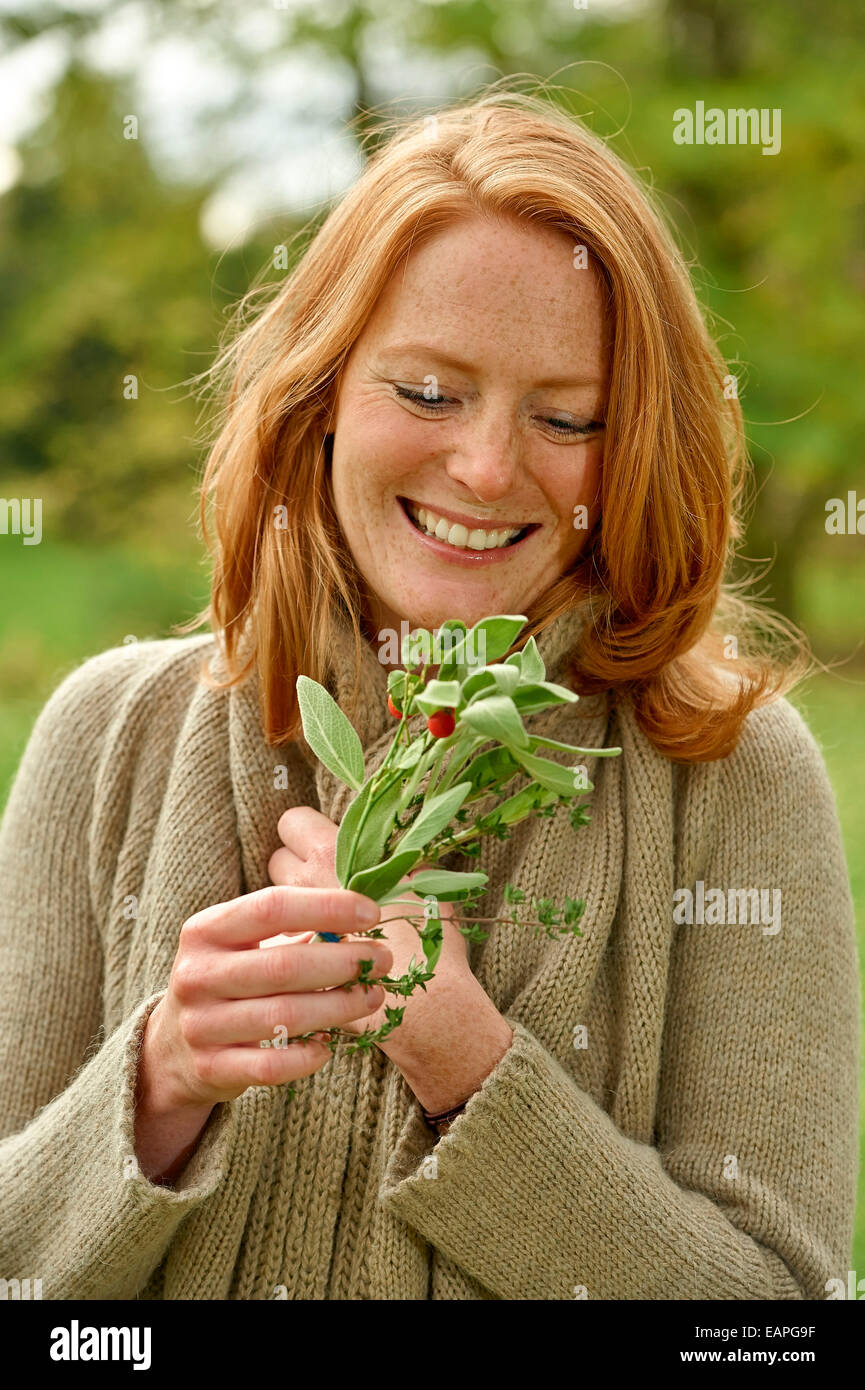 Woman smelling salvia hi-res stock photography and images - Alamy