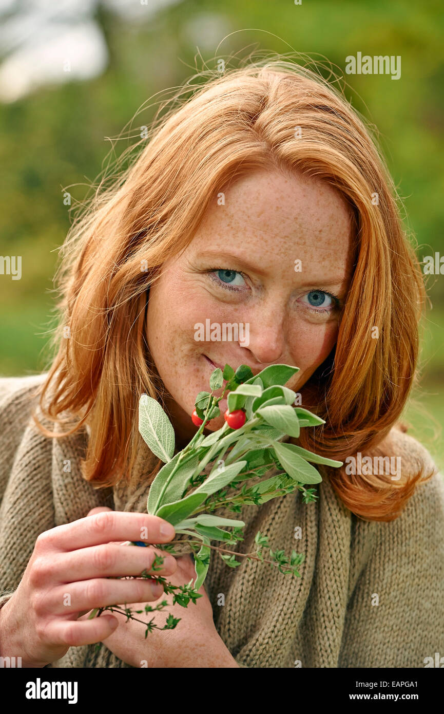 Woman smelling salvia hi-res stock photography and images - Alamy