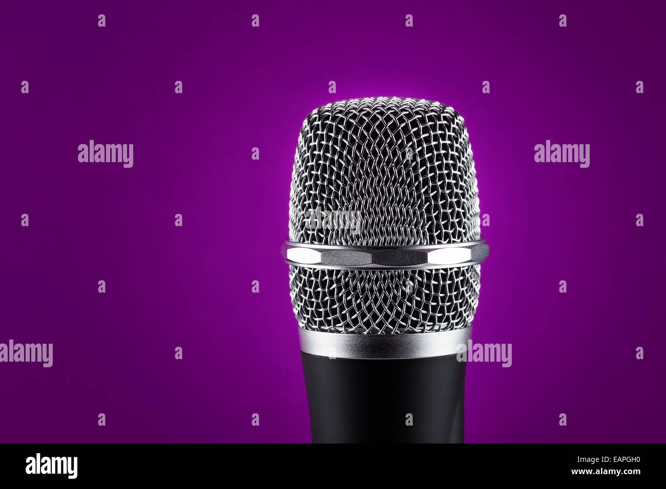 Wireless microphone closeup on purple background Stock Photo - Alamy