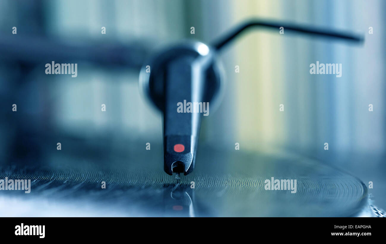 Dj needle stylus on spinning record, vinyl background Stock Photo - Alamy