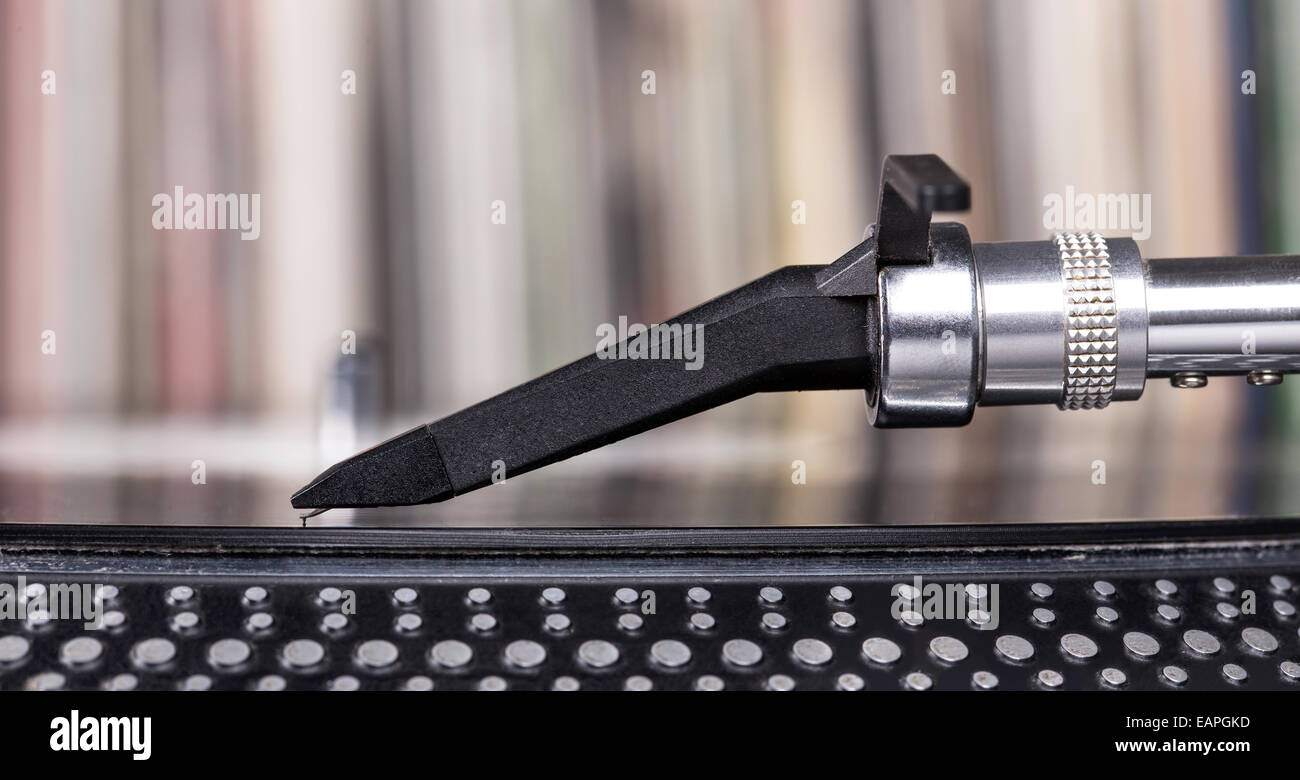 Dj needle stylus on spinning record, vinyl background Stock Photo - Alamy