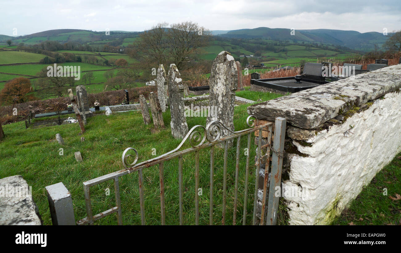 Grey skies on a Novemberautumn morning in a rural country graveyard at ...