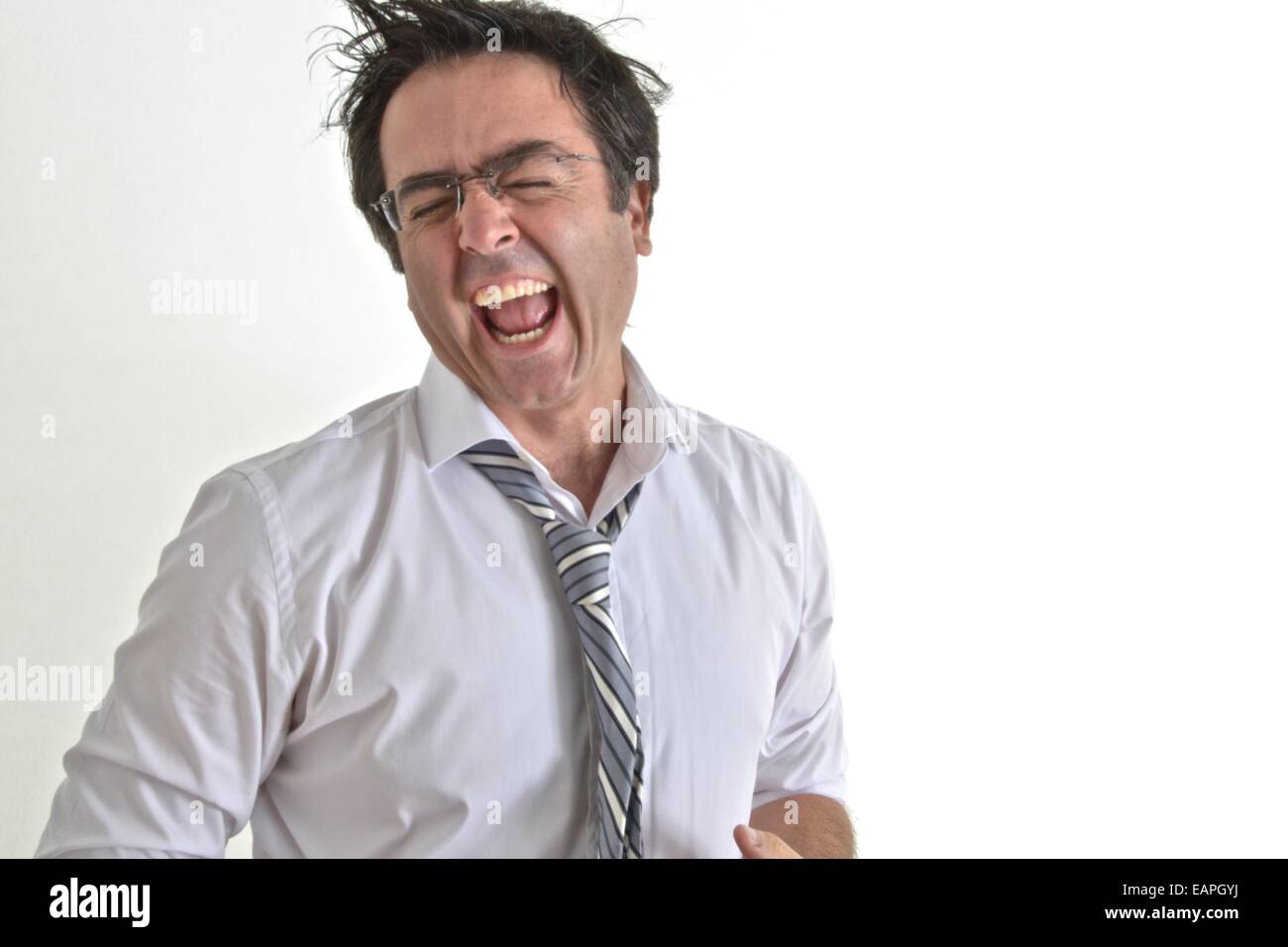 Hispanic happy man singing in the office Stock Photo - Alamy