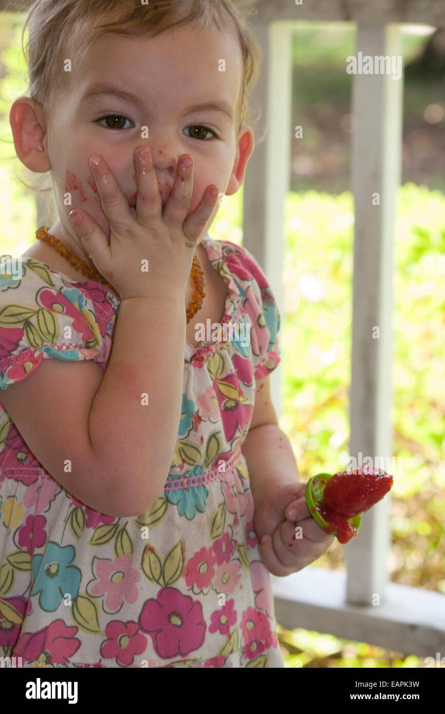 Toddler eating homemade popsicle Stock Photo - Alamy