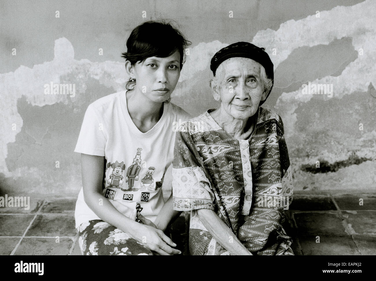 Old lady and her great granddaughter in Yogyakarta in Java in Indonesia ...