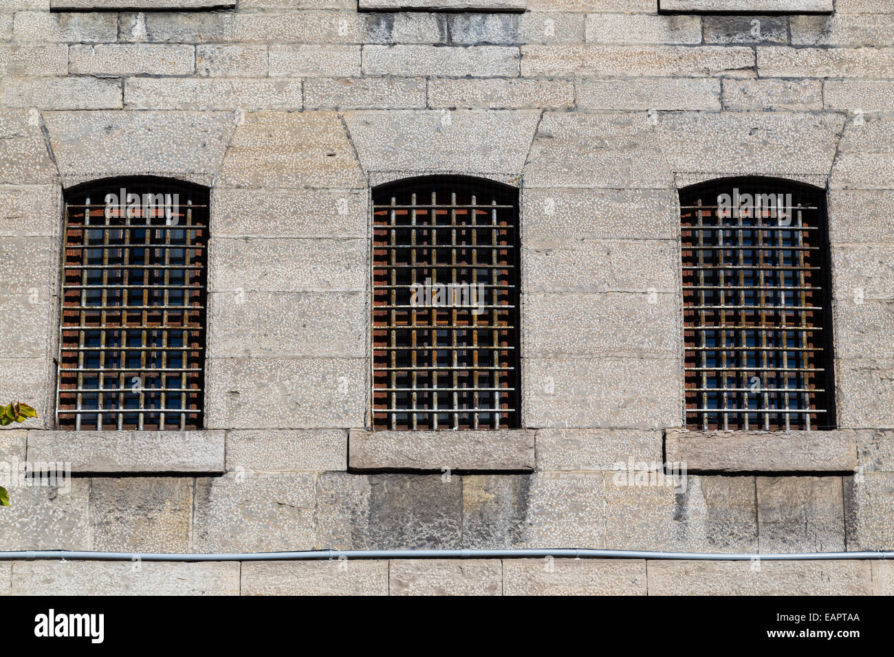 Closeup to a window with bars Stock Photo - Alamy