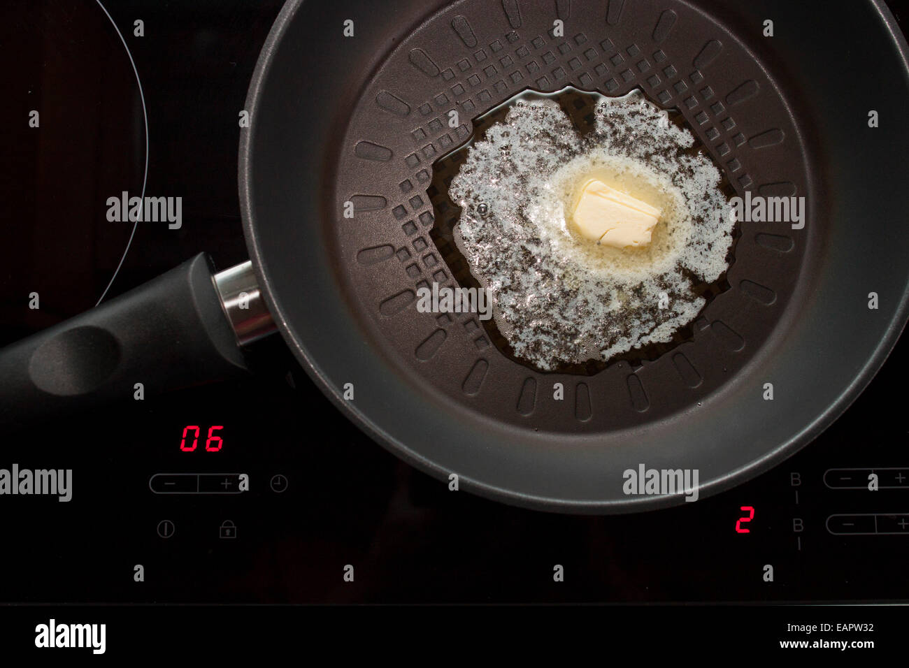 Butter melting in a pan Stock Photo - Alamy