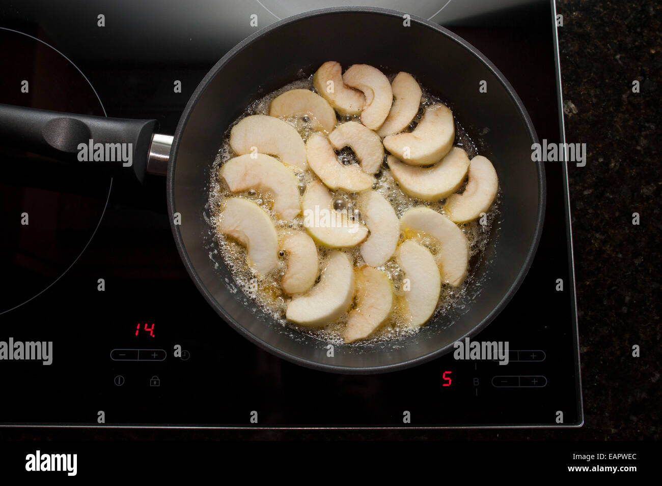 Cooking apples in a pan Stock Photo - Alamy