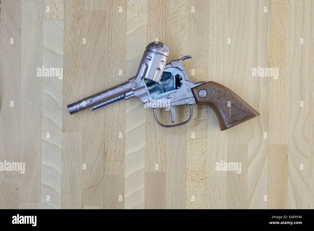A close up shot of a toy hand gun Stock Photo - Alamy