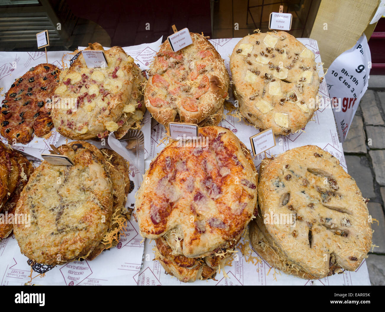Pizza Breads. A display of small loaves of bread dressed as exotic ...