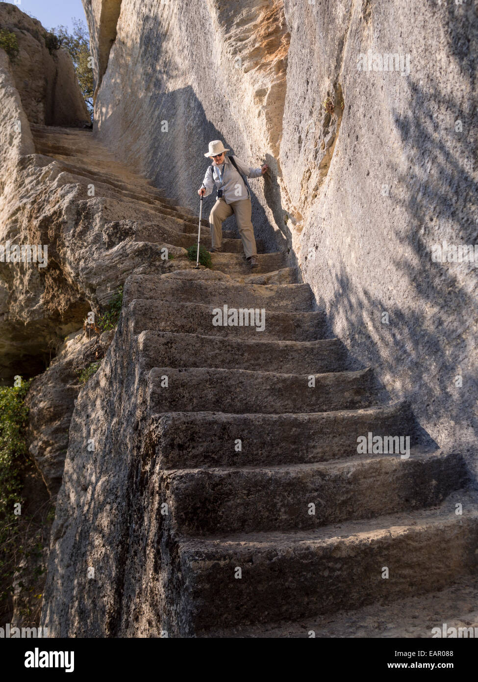 Woman descending steps hi-res stock photography and images - Alamy