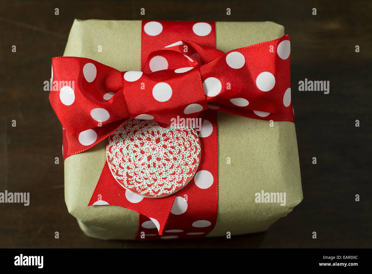 gift box handmade dotted red tape and label, wrapped in brown paper ...